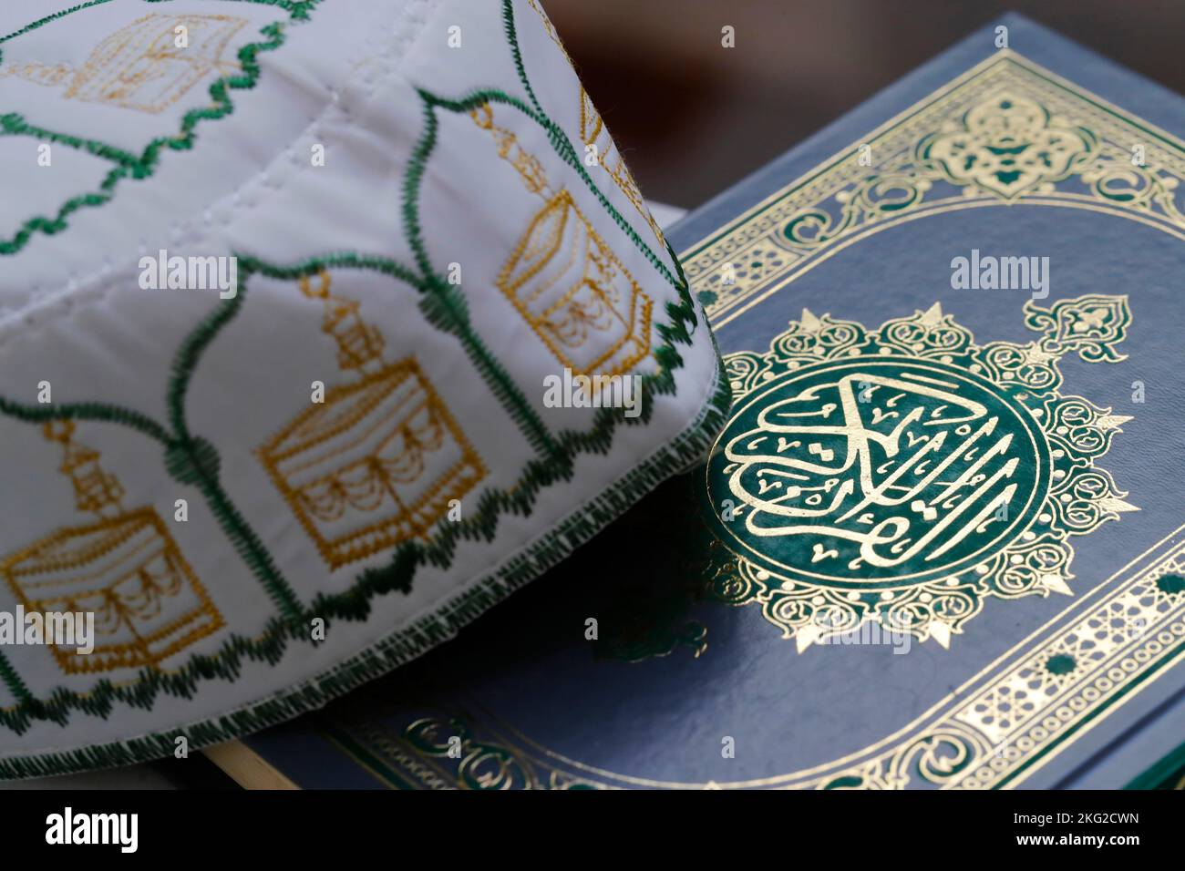 Islam symbols. Muslim Holy Quran and Kufi Cap. Spain Stock Photo - Alamy