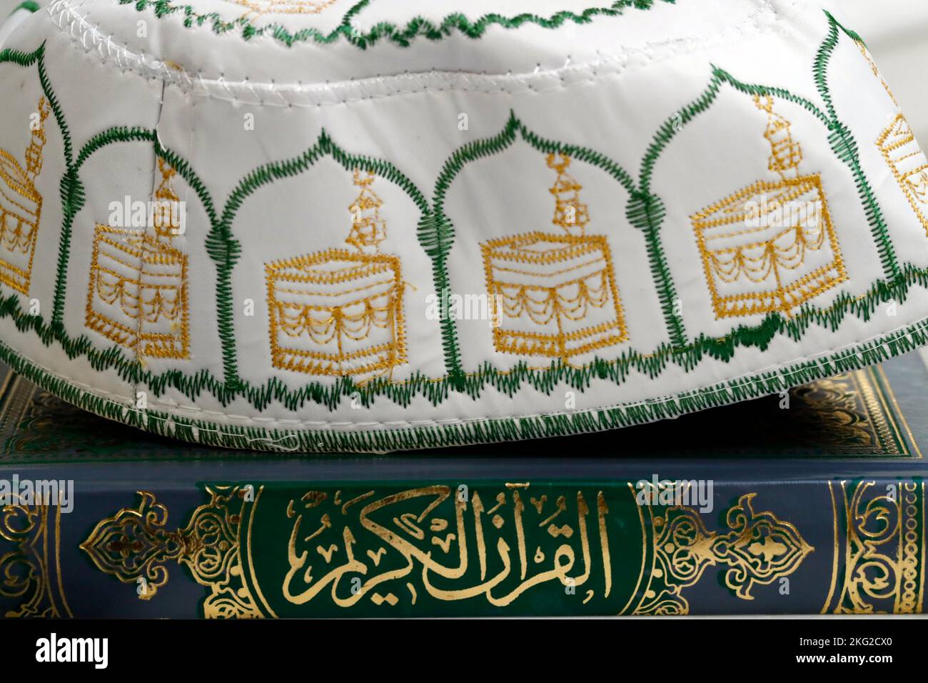 Islam symbols. Muslim Holy Quran and Kufi Cap. Spain Stock Photo - Alamy