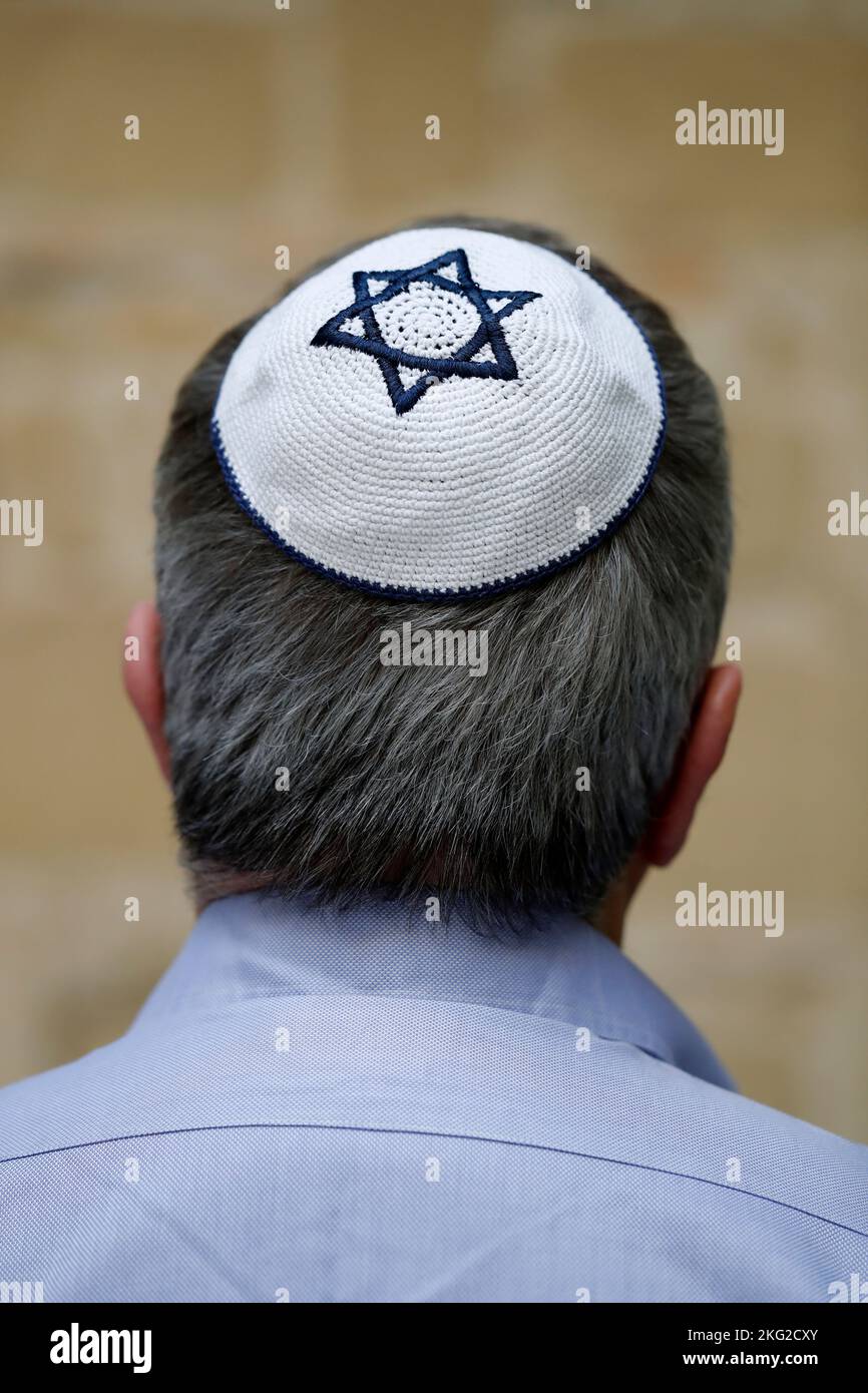 Back view of a man wearing a kippa which shows the star of David on the ...