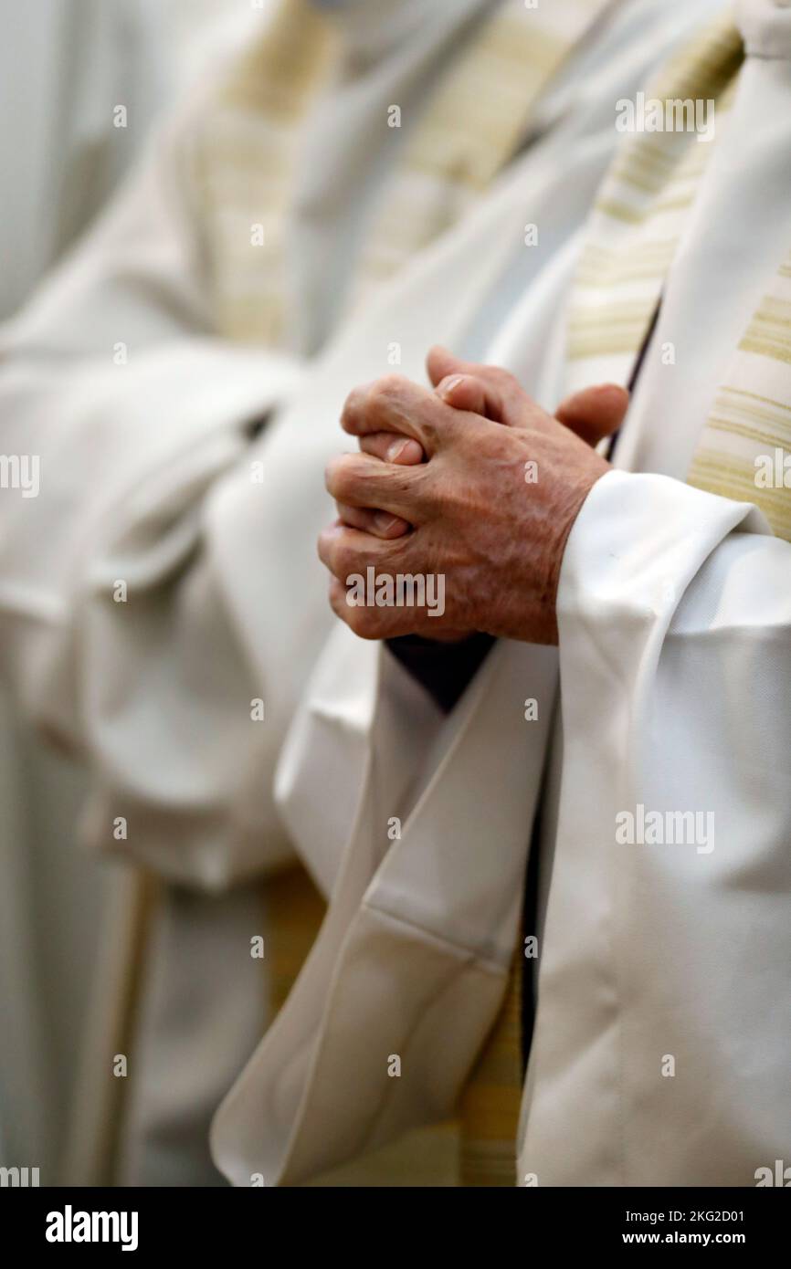 Priest at mass celebration in a catholic church. Saint Julien en ...