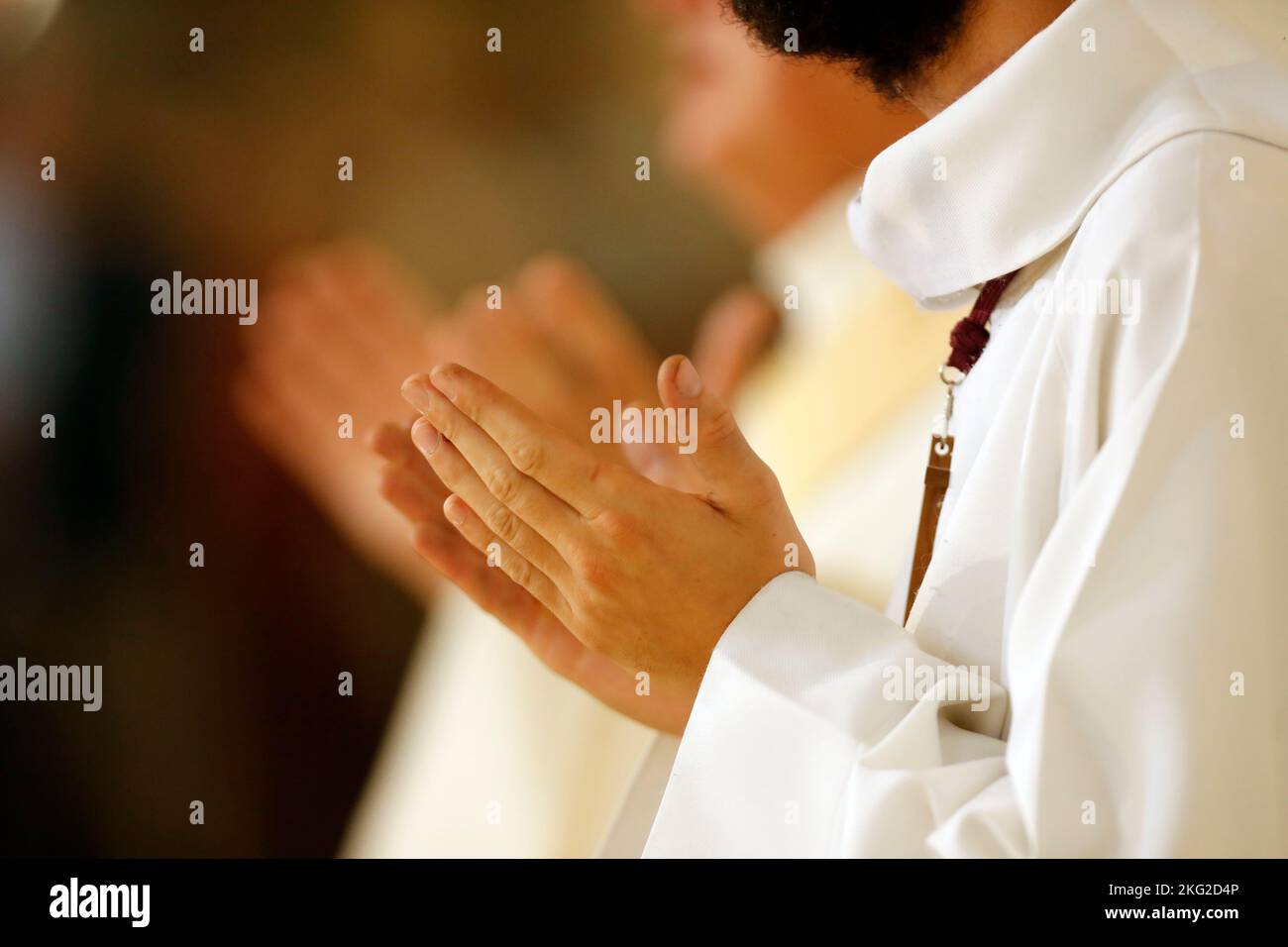 Catholic church. Altar boy praying at mass. France Stock Photo - Alamy