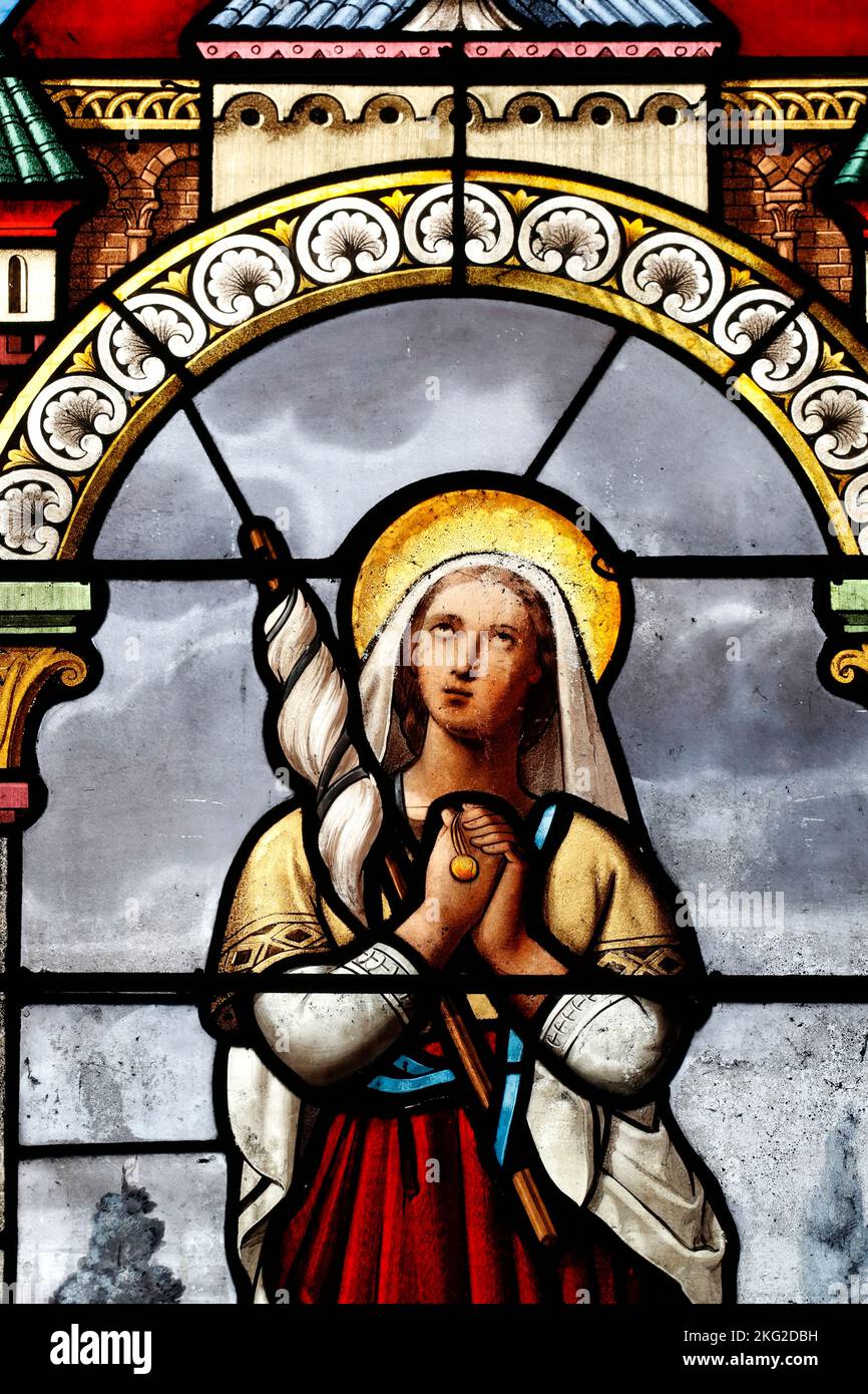 Sainte Jeanne d'Arc church. Stained glass window. St Genevieve is the ...