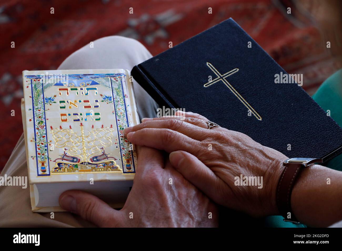 Jewish man and christian woman reading a Torah and a Holy Bible ...