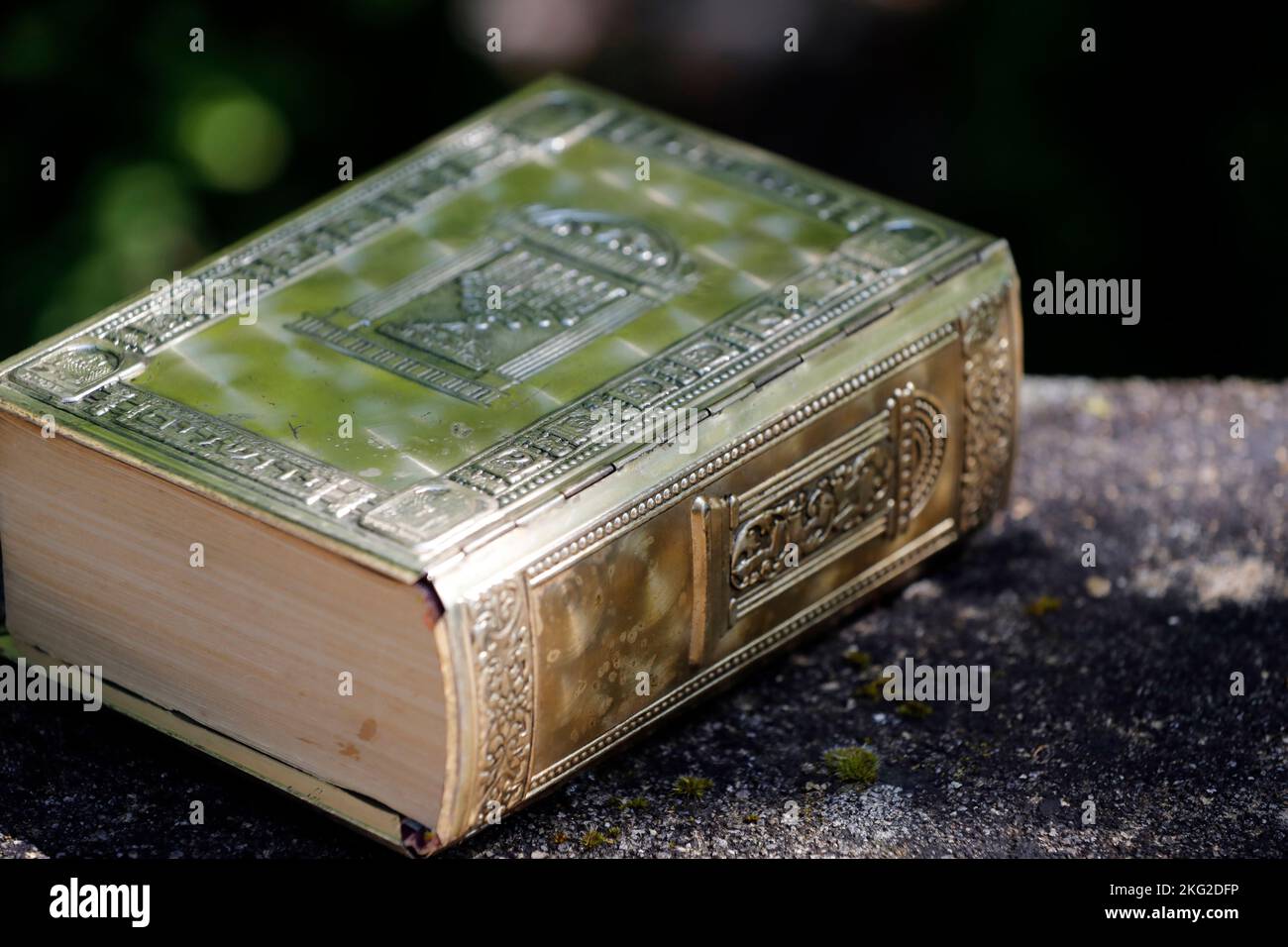 Old Torah book with the the five books of Moses. Cover with a menorah ...