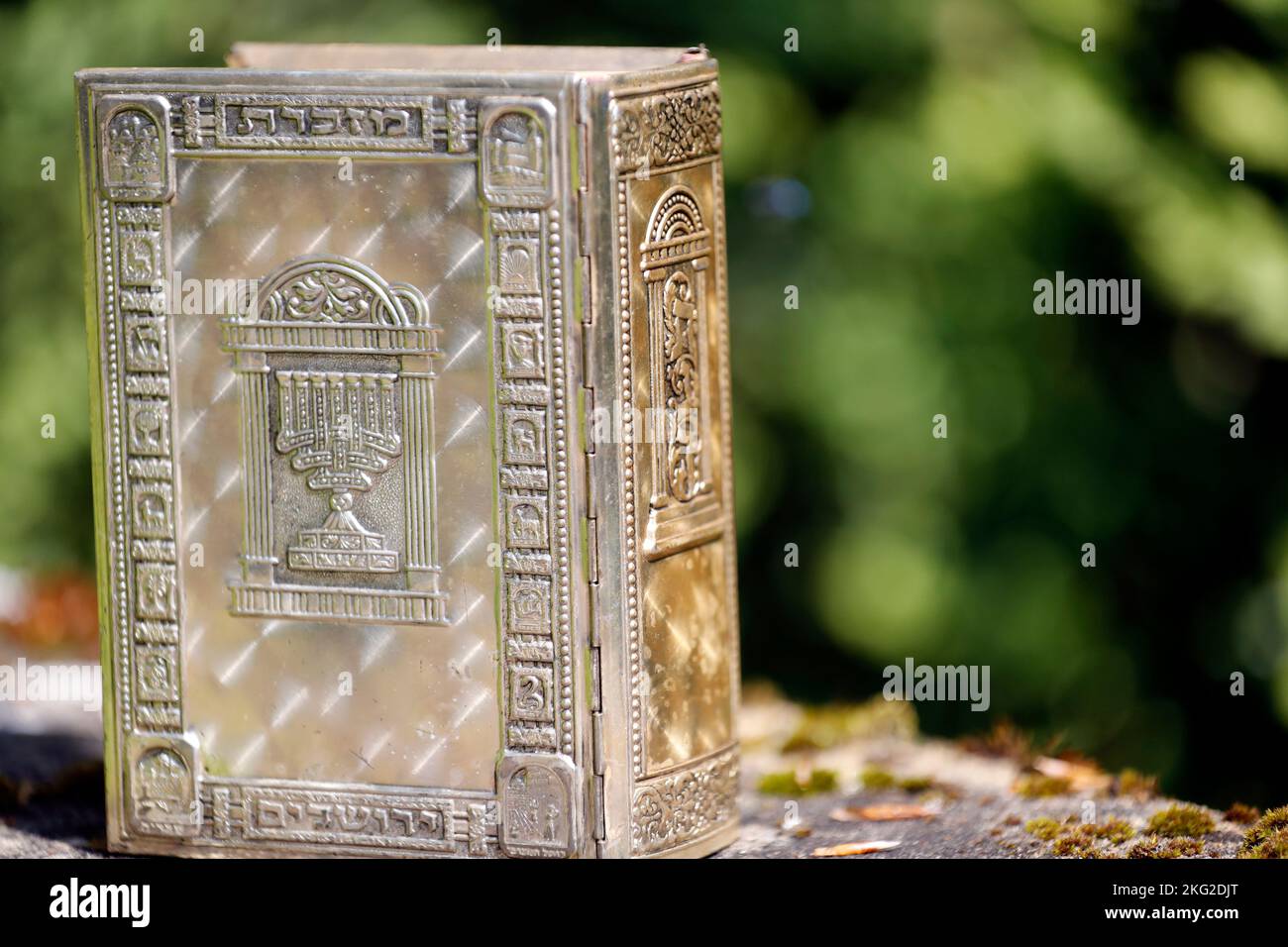 Old Torah book with the the five books of Moses. Cover with a menorah ...