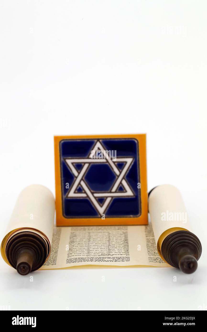 Star of David and small Torah scrolls. Symbol of Jewish identity and ...
