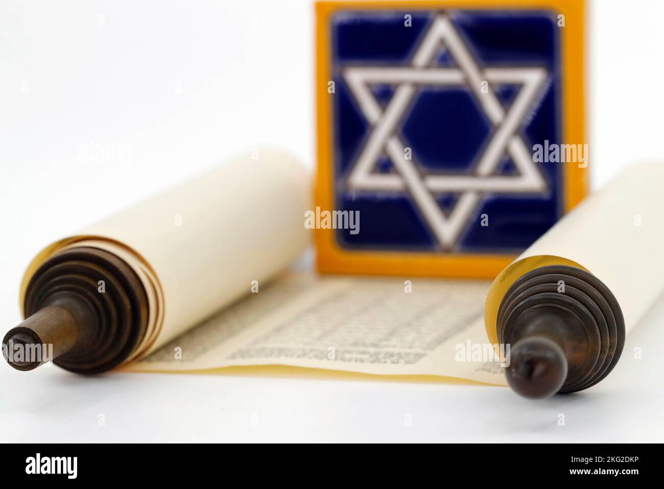 Star of David and small Torah scrolls. Symbol of Jewish identity and ...