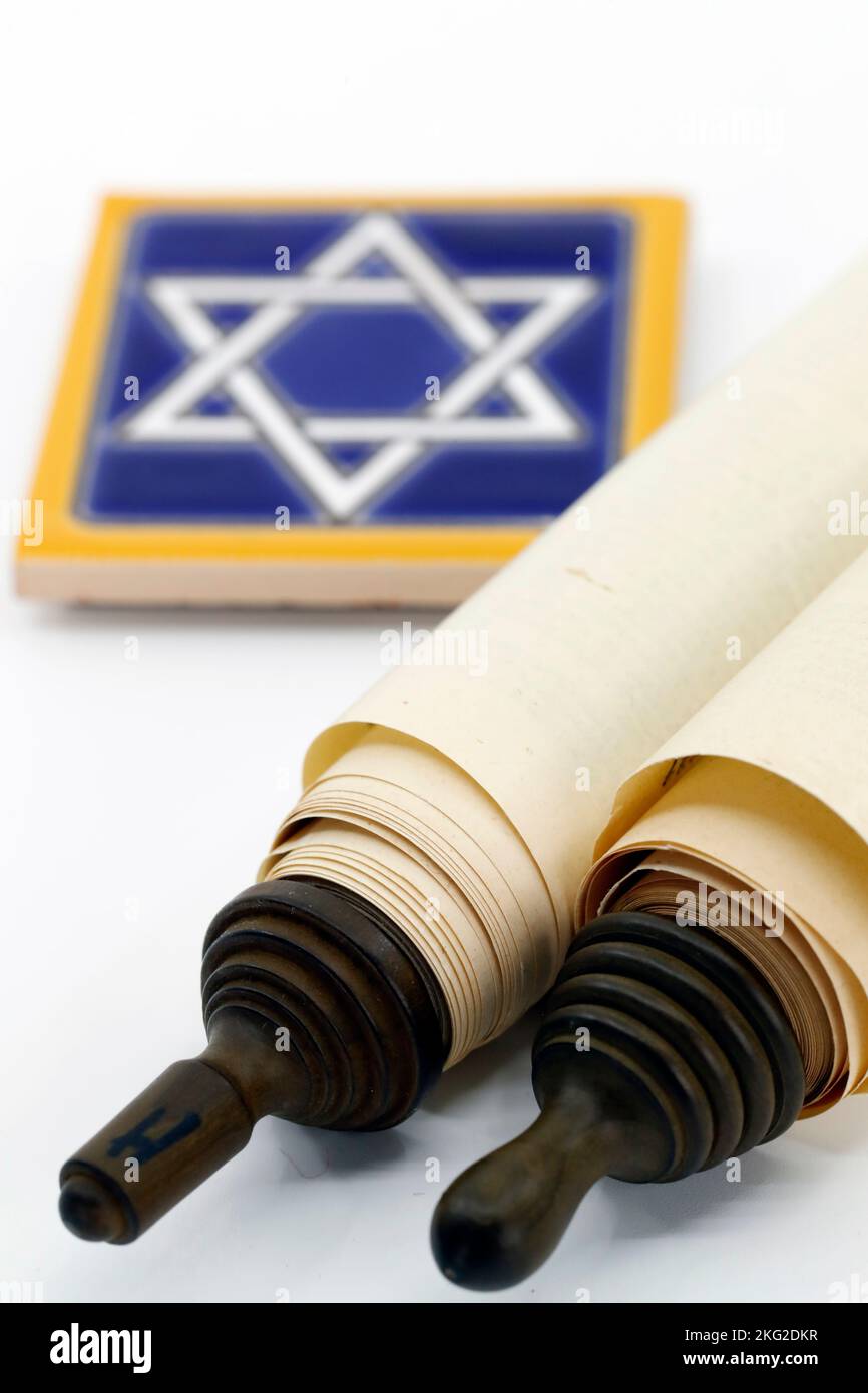 Star of David and small Torah scrolls. Symbol of Jewish identity and ...