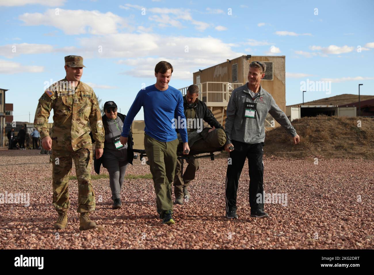 Participants execute a litter carry for Tactical Combat Casualty Care ...