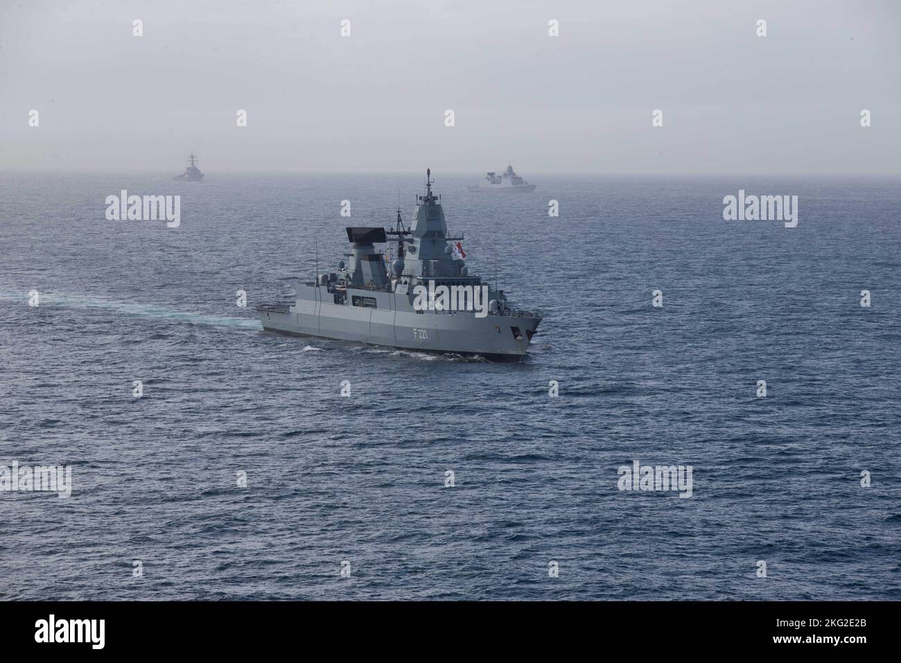 The German frigate FGS Hessen (F 221) steams in formation with the ...