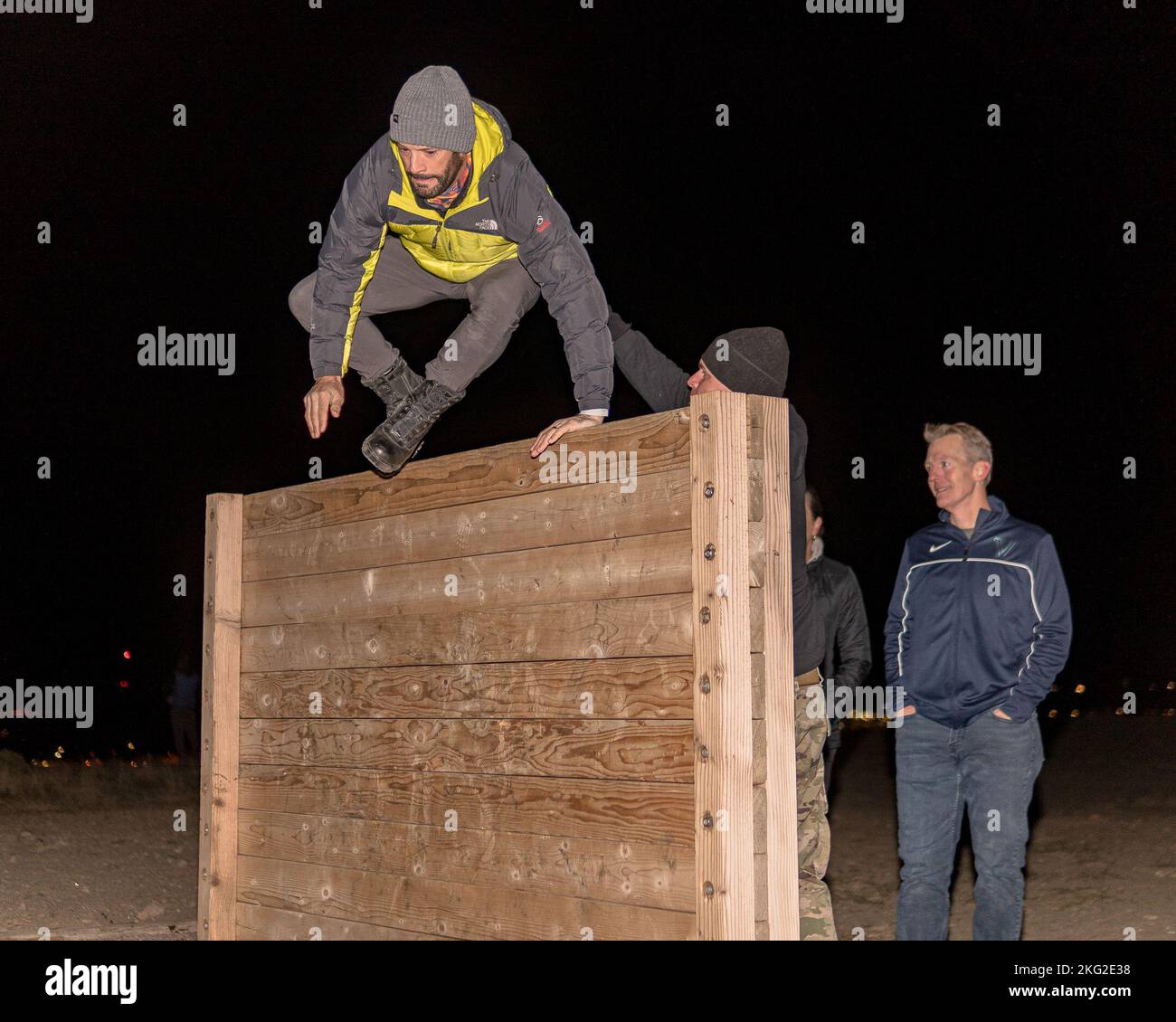An Joint Civilian Orientation Conference participant jumps over a wall ...