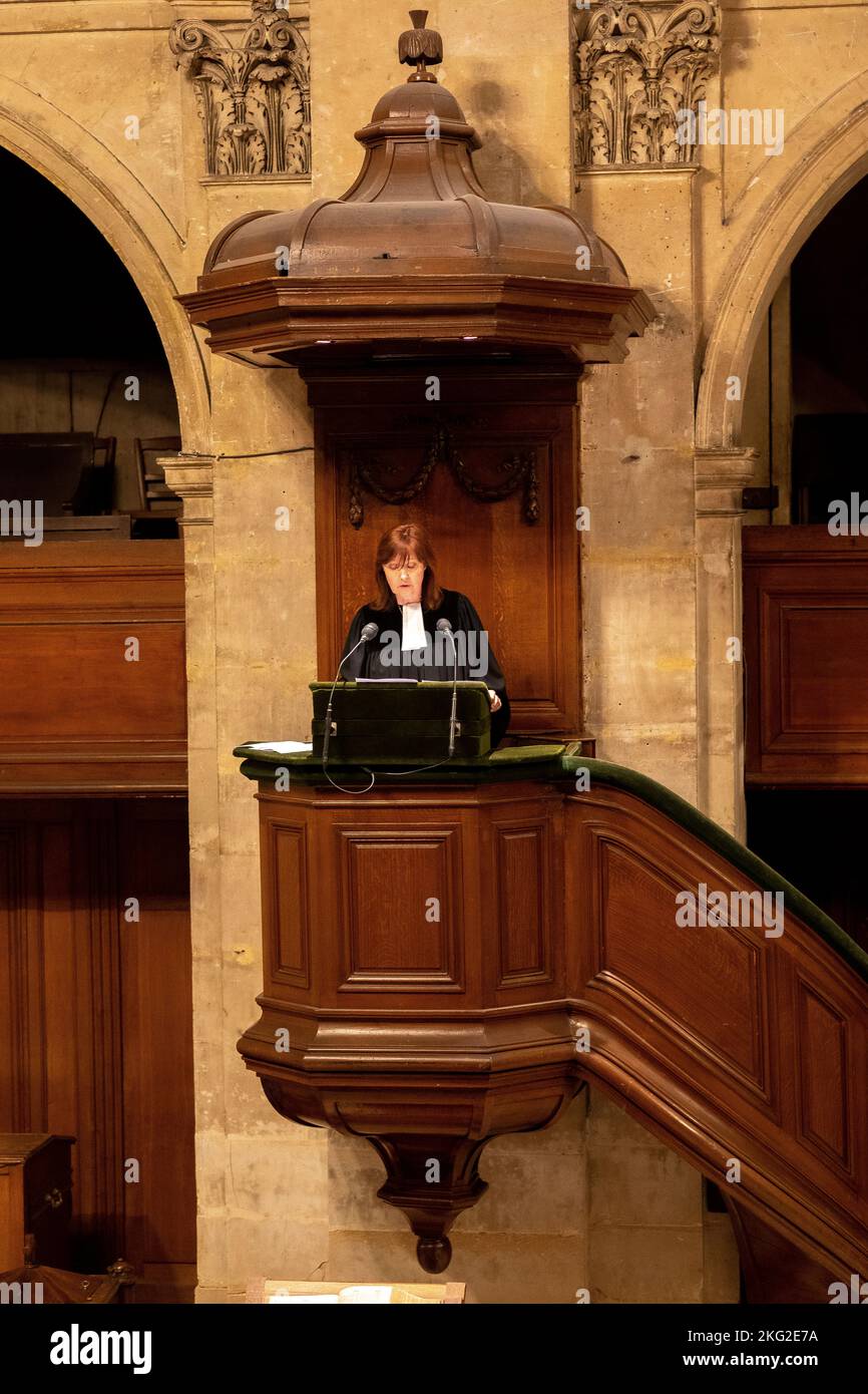Clergywoman standing and speaking at the pulpit of the Oratoire du ...