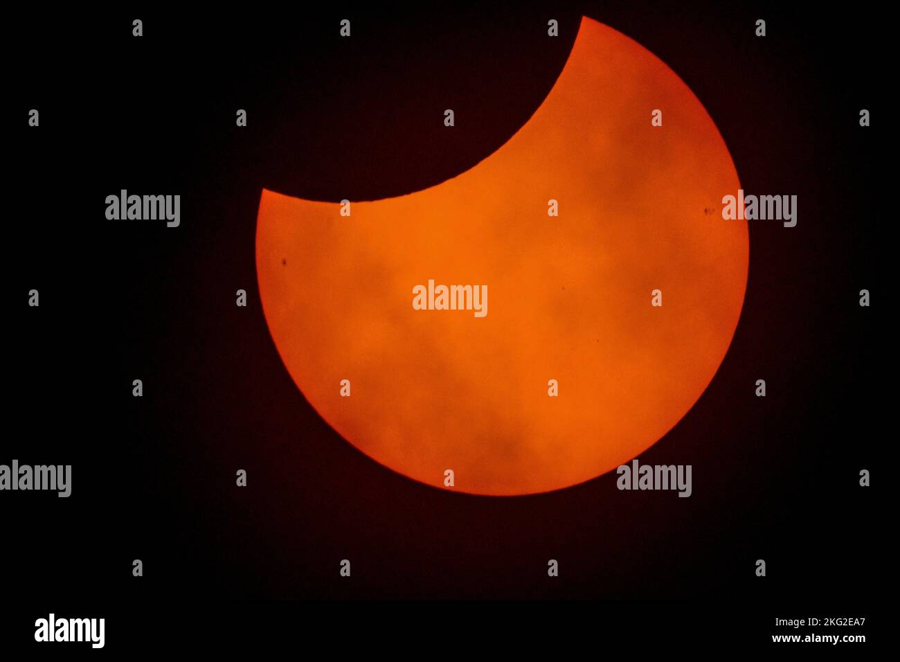 The moon captured during solar eclipse at night Stock Photo - Alamy