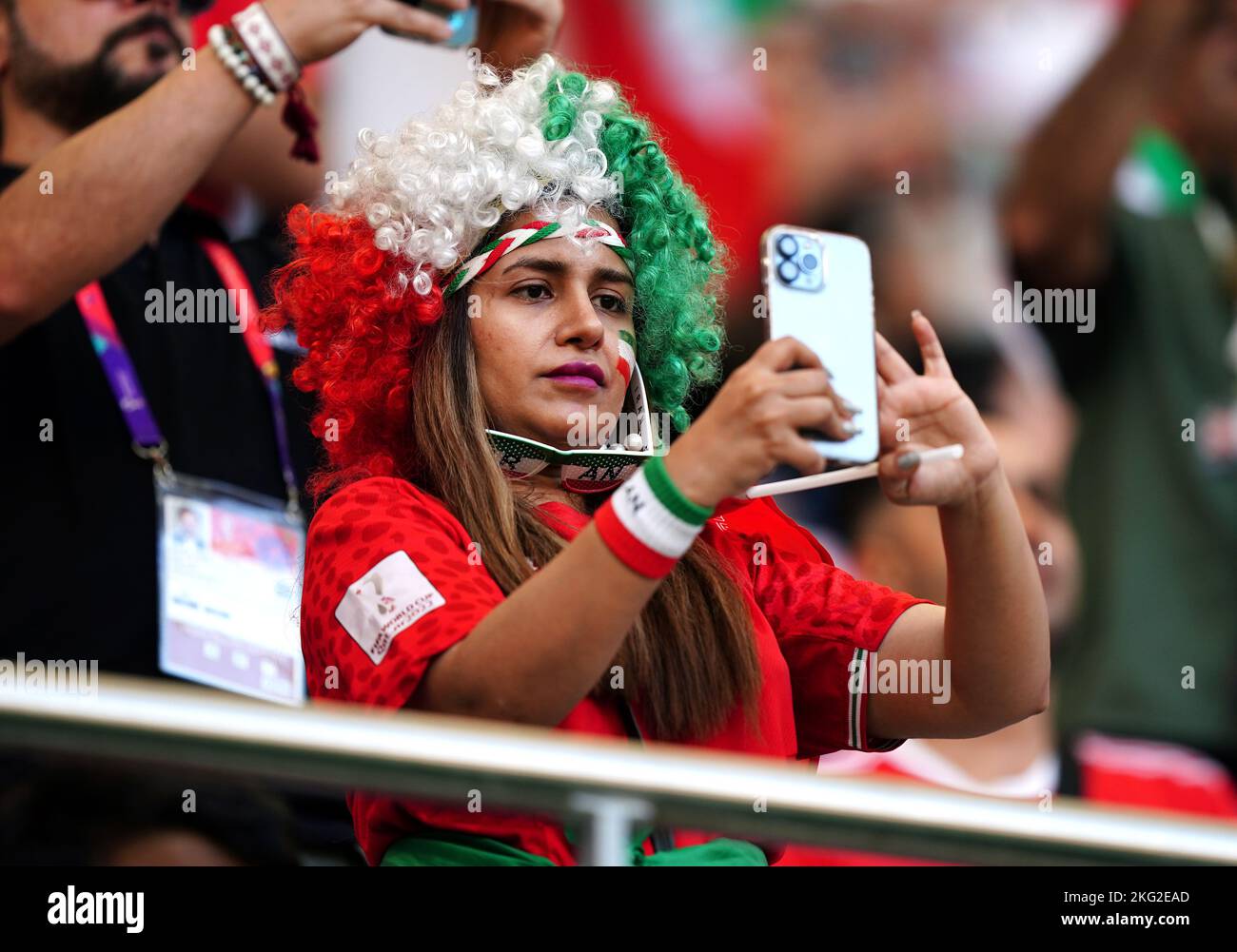 An Iran fan in the stands takes a photograph ahead of the FIFA World ...