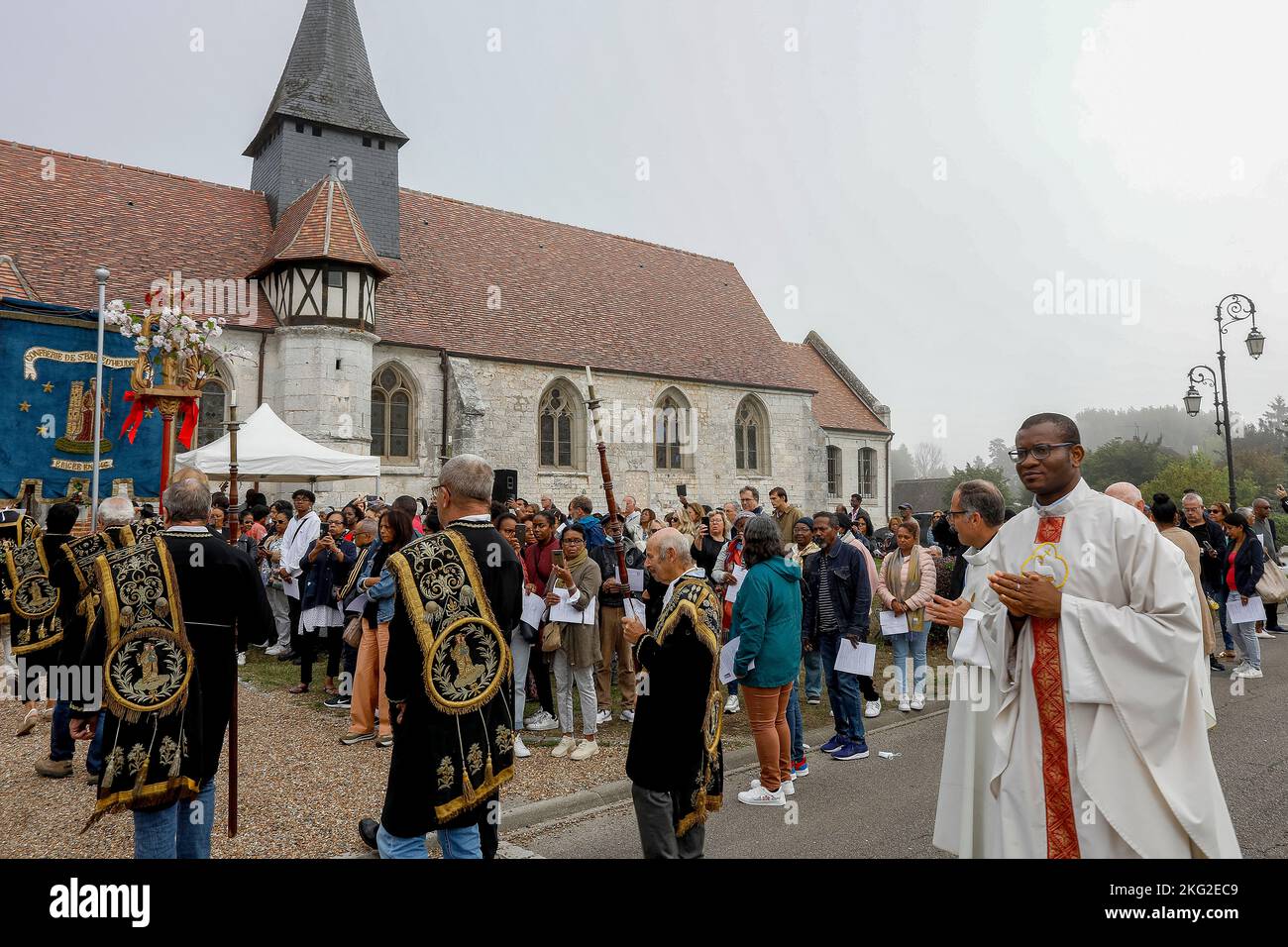 Mass outside Holy Trinity church, Pinterville, France. Charitons ...