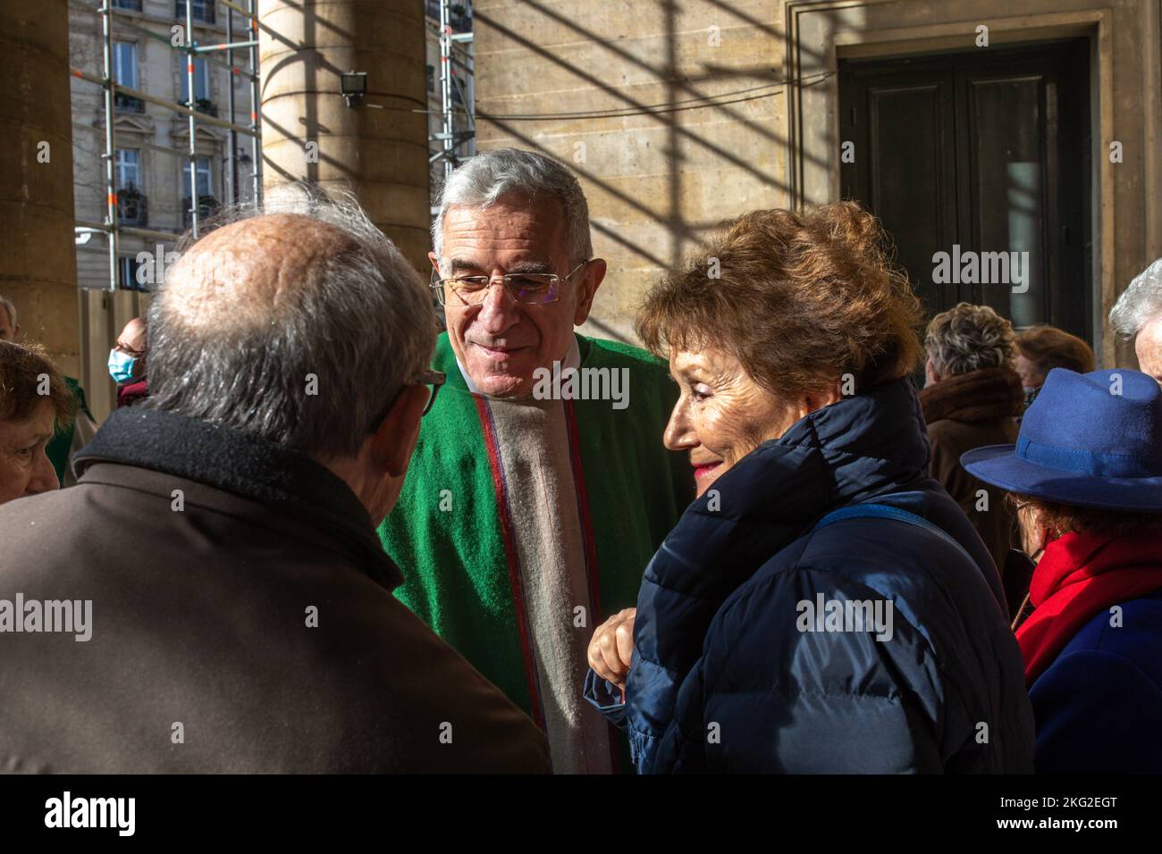 Catholic priest meeting parishioners after mass in Paris, France Stock ...