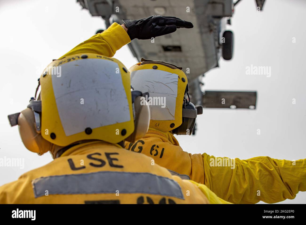 Boatswain’s Mate 3rd Class Elvin Rivera Perez, right, assigned to the ...