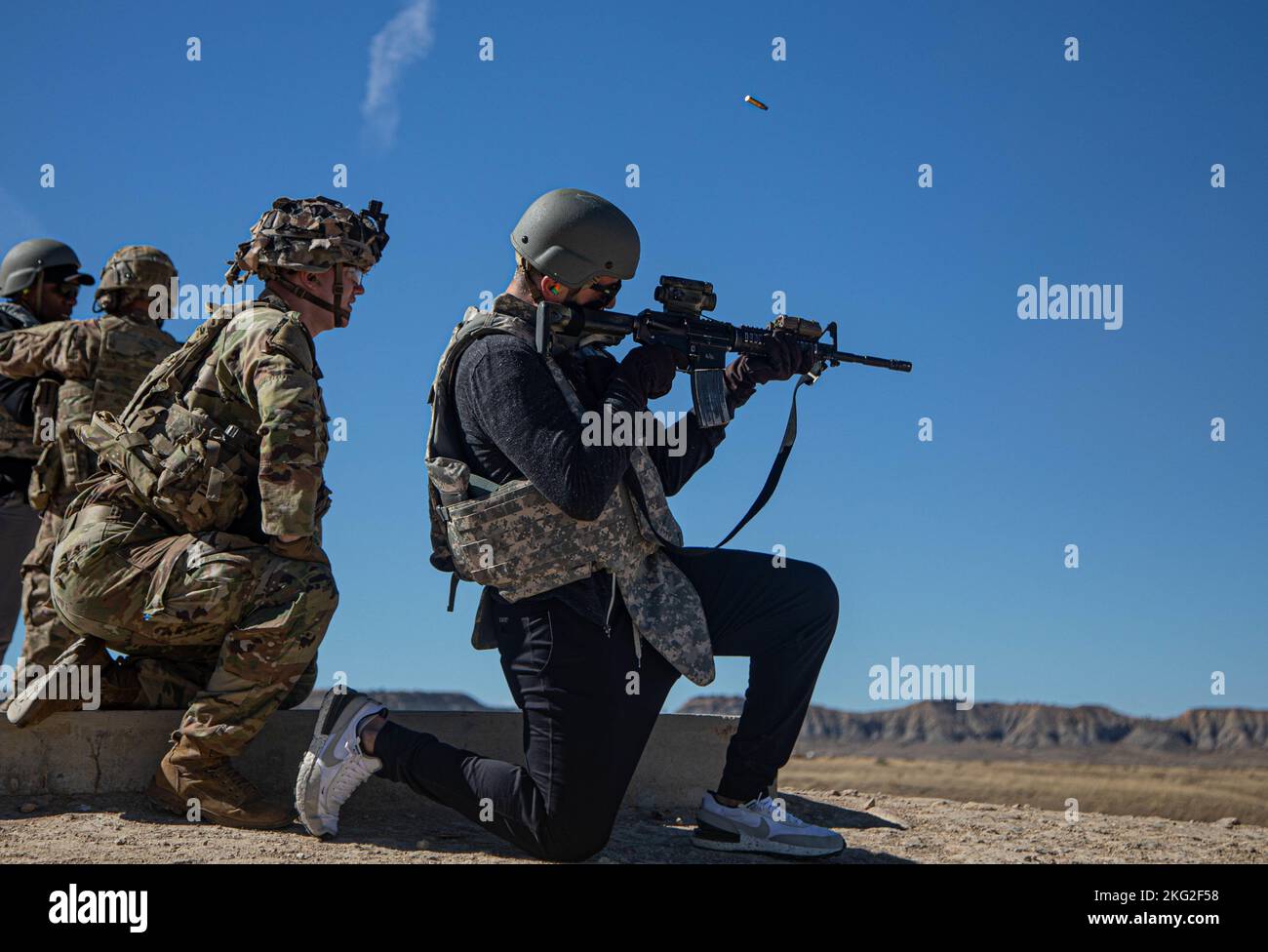 A civilian participant fires an M4 Carbine rifle during the Joint ...