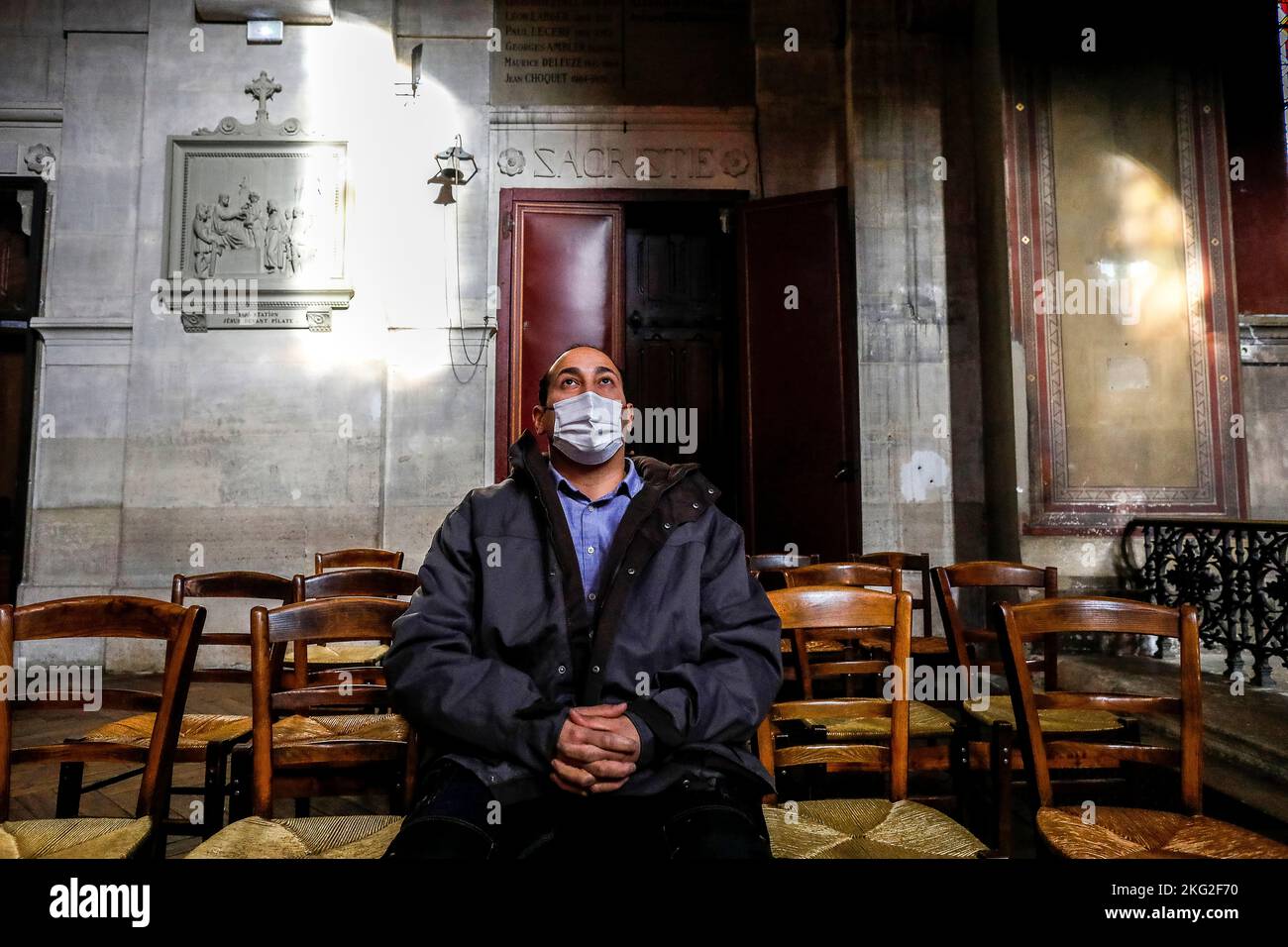 Former muslim converted to christianity praying in Notre-Dame de la ...