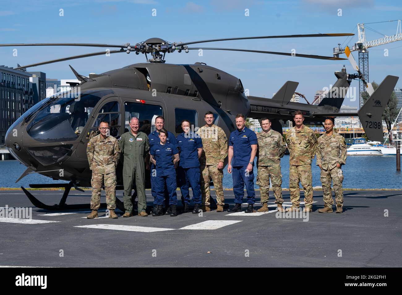 U.S. Coast Guard members poses for a group photo with members from the ...