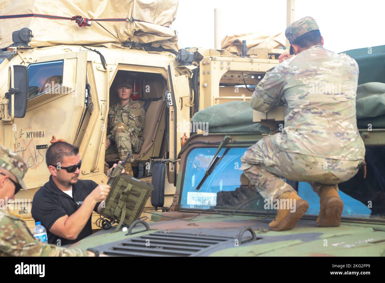 Civilian technicians assist Soldiers assigned to to 65th Brigade ...