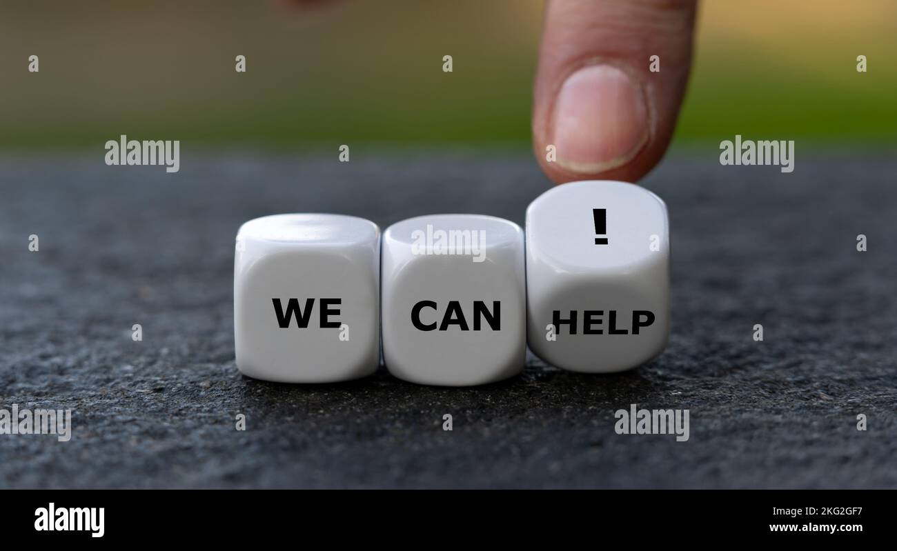Dice form the offer 'we can help!' Stock Photo - Alamy