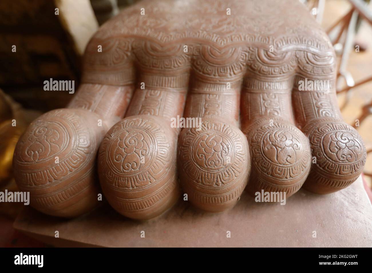 Life of Buddha. Wat Ounalom monastery. Decorated feet and toes of ...