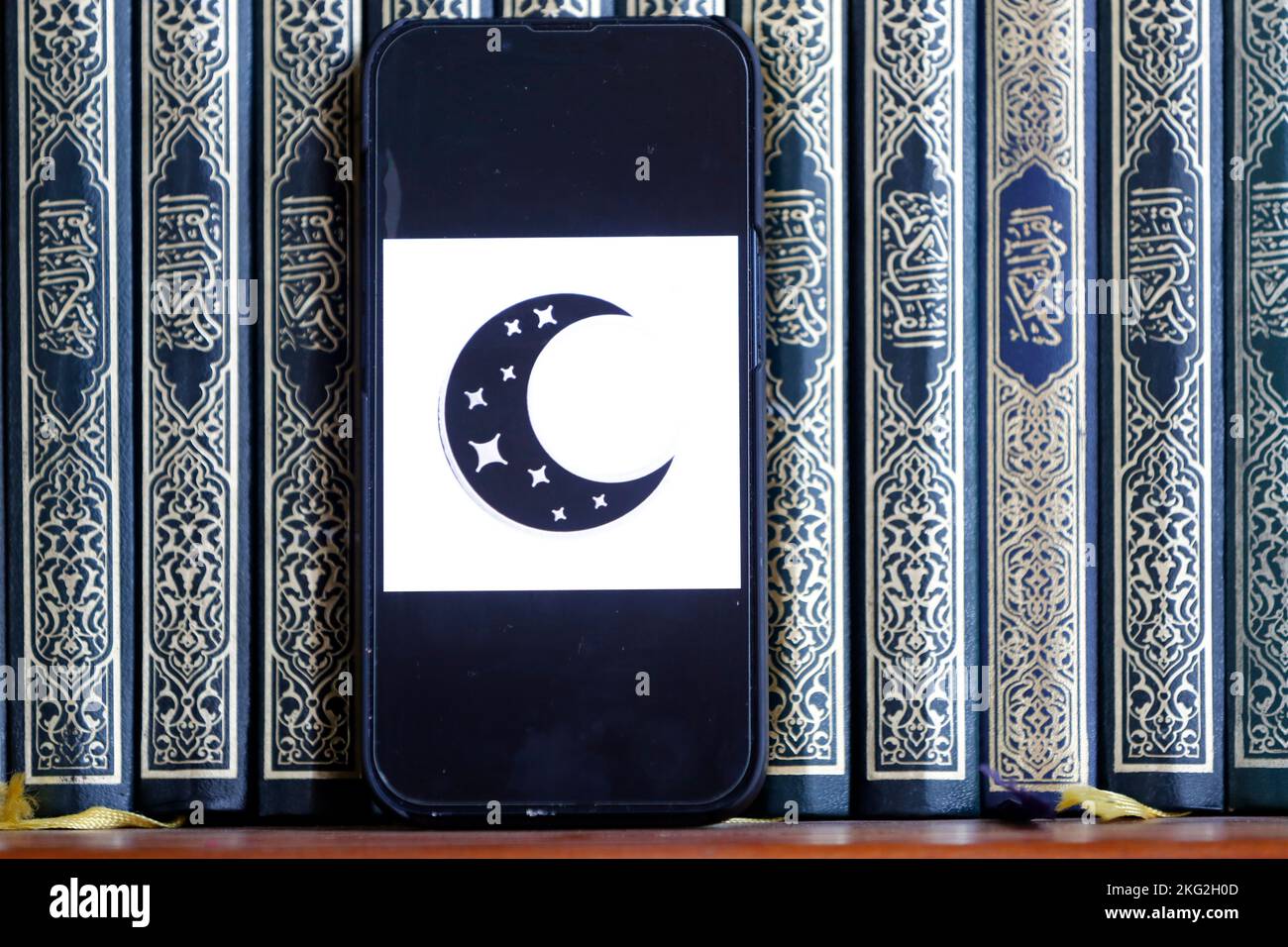 Al-Serkal Mosque. Digital Quran on a smartphone and traditional paper ...