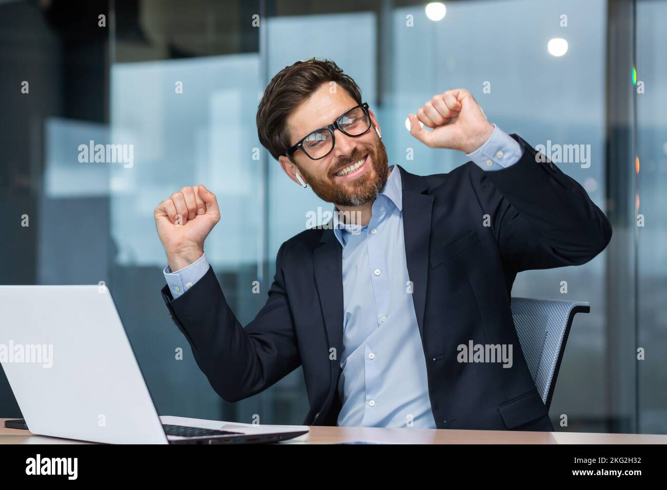 Mature businessman dancing working laptop hi-res stock photography and ...