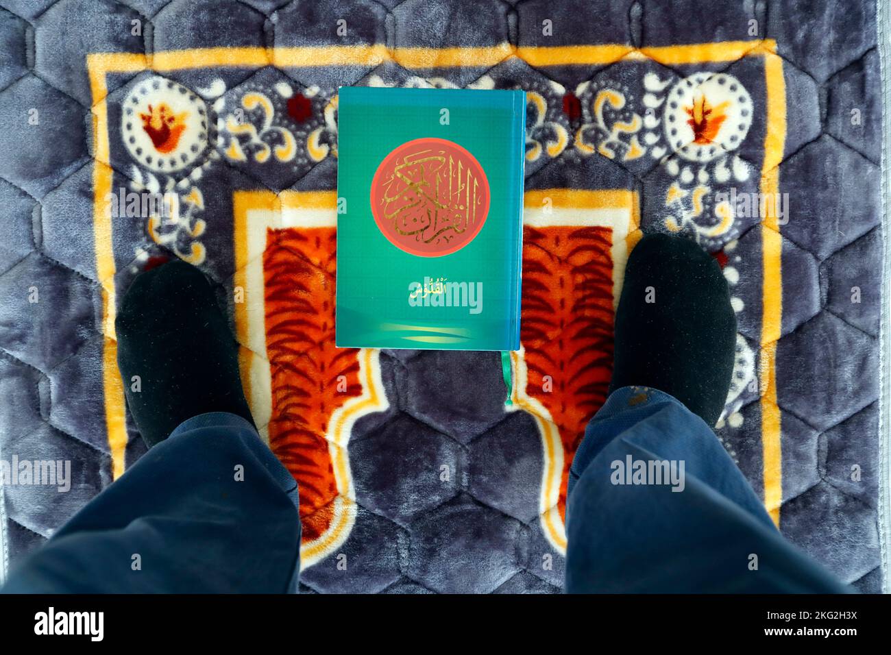 Al-Serkal Mosque. Muslim man praying on carpet in mosque. Phnom Penh ...