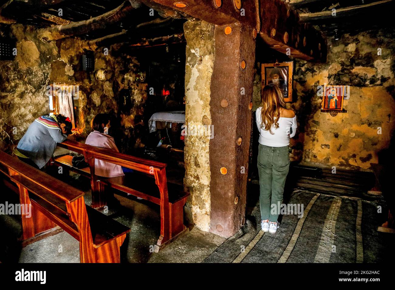 Faithful praying in Saint Charbel's monastery chapel in Bekaa Kafra ...