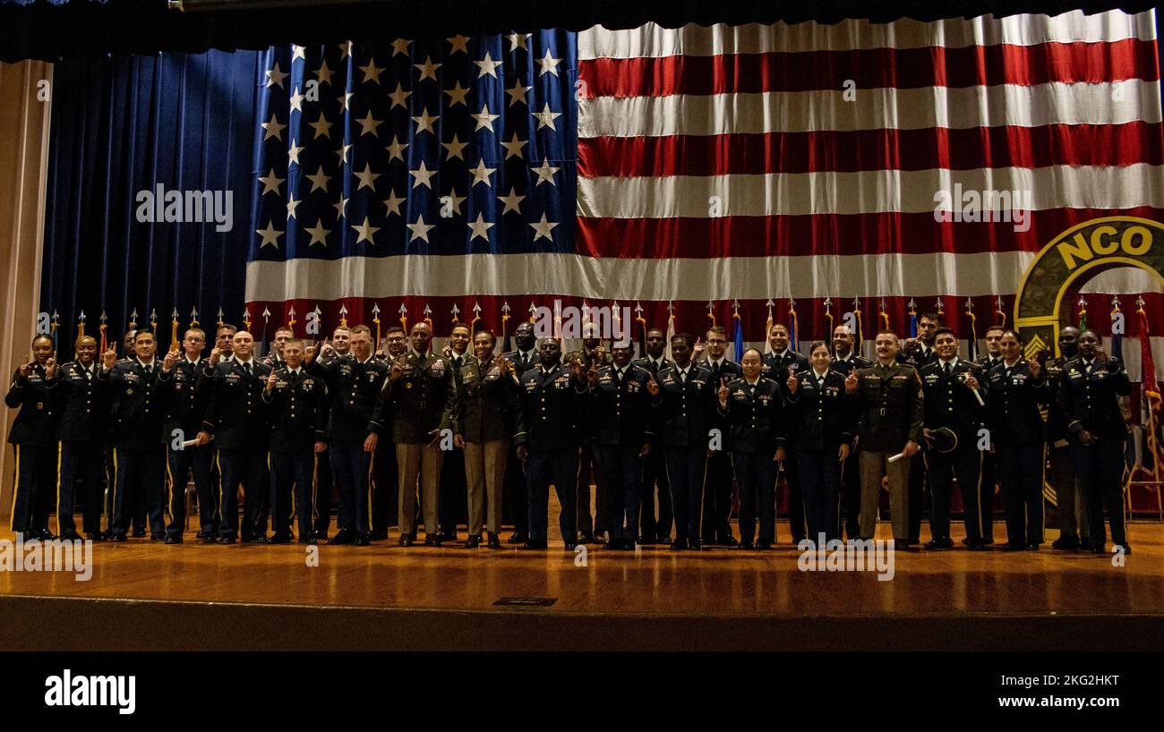 Newly inducted non-commissioned officers pose for a photo after an NCO ...