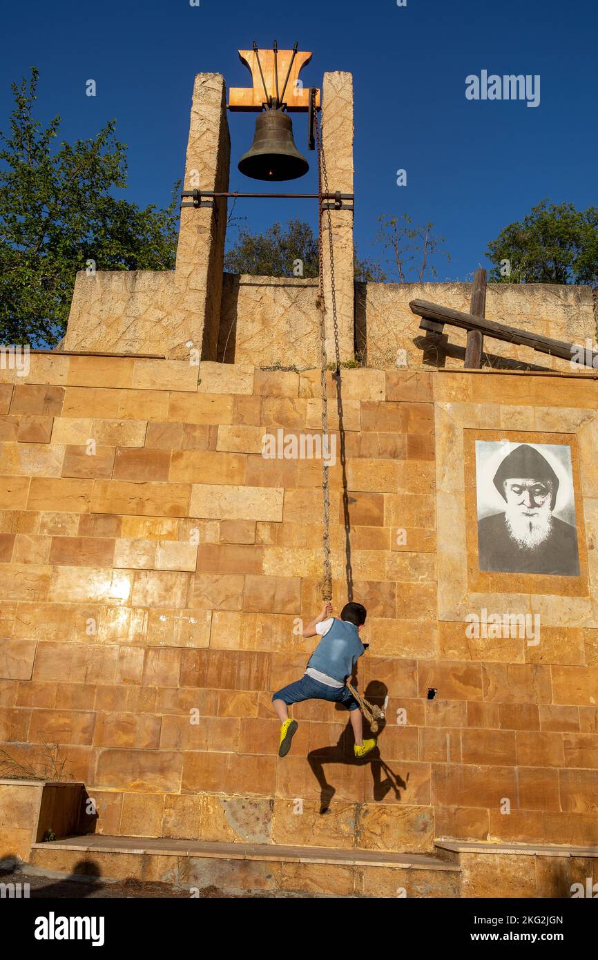 Children playing with a maronite church bell rope in Wadi El Chahrour ...