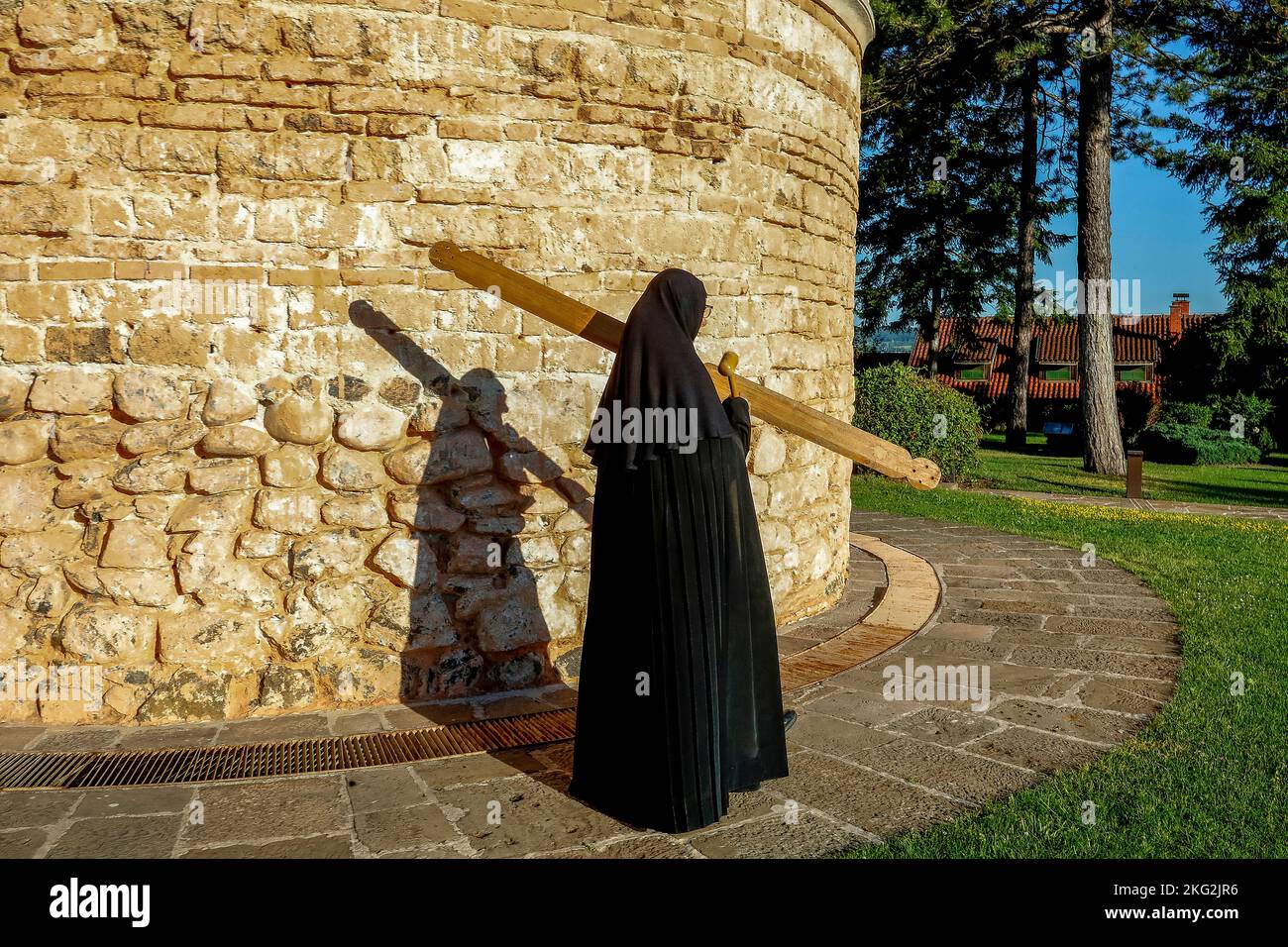 Zica orthodox monastery near Kraljevo, Serbia. Nun sounding the call to ...