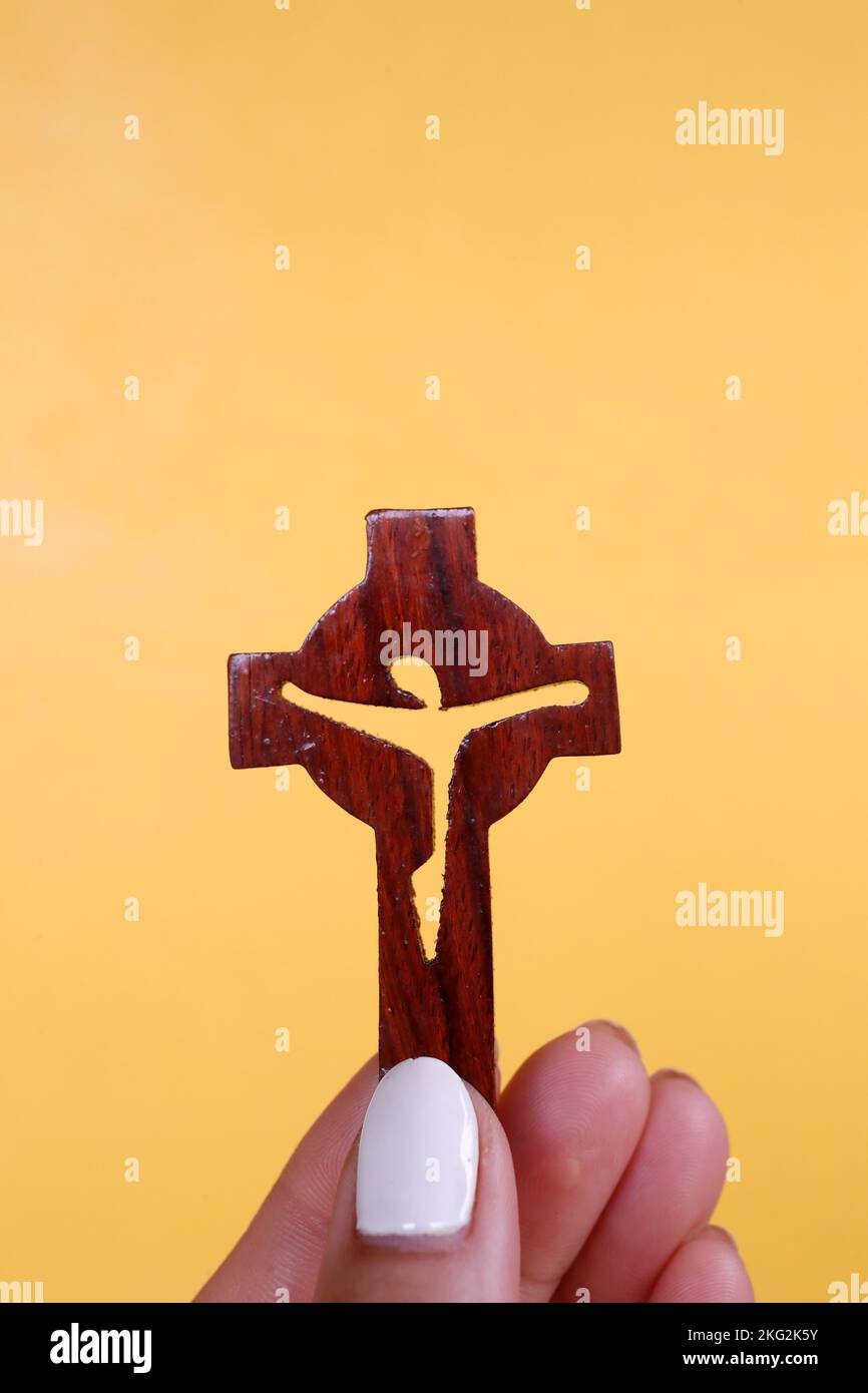 Woman with a christian cross in hand. Faith and religion concept Stock ...