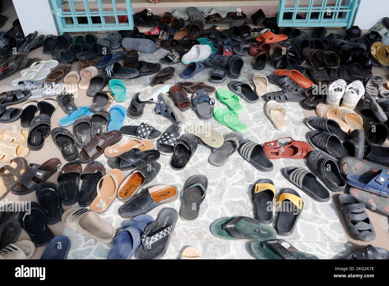 The friday prayer (jummah). Shoes outside the mosque. Chau Doc. Vietnam ...
