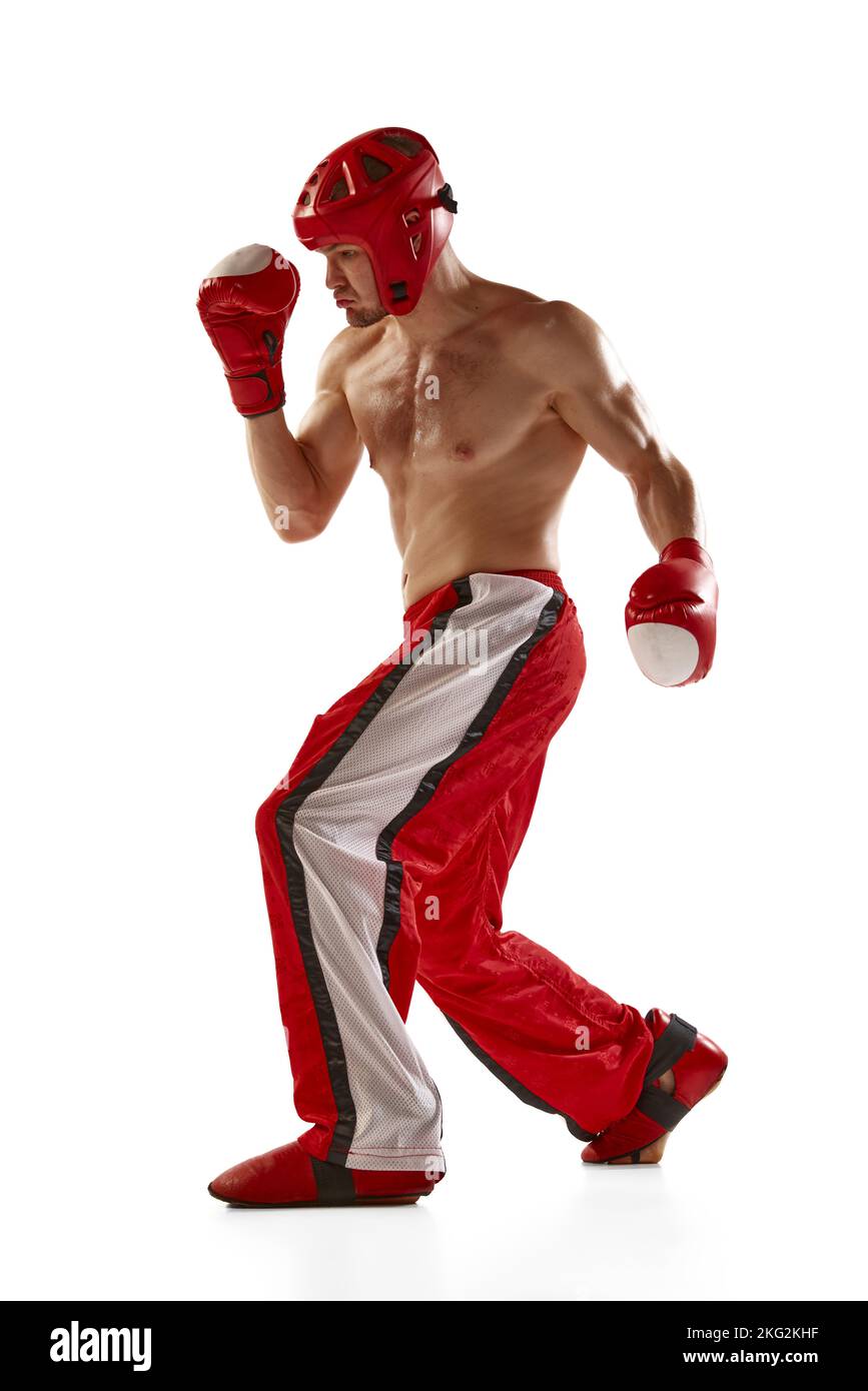 Dynamic portrait of young muscled athlete, professional kickboxer in ...