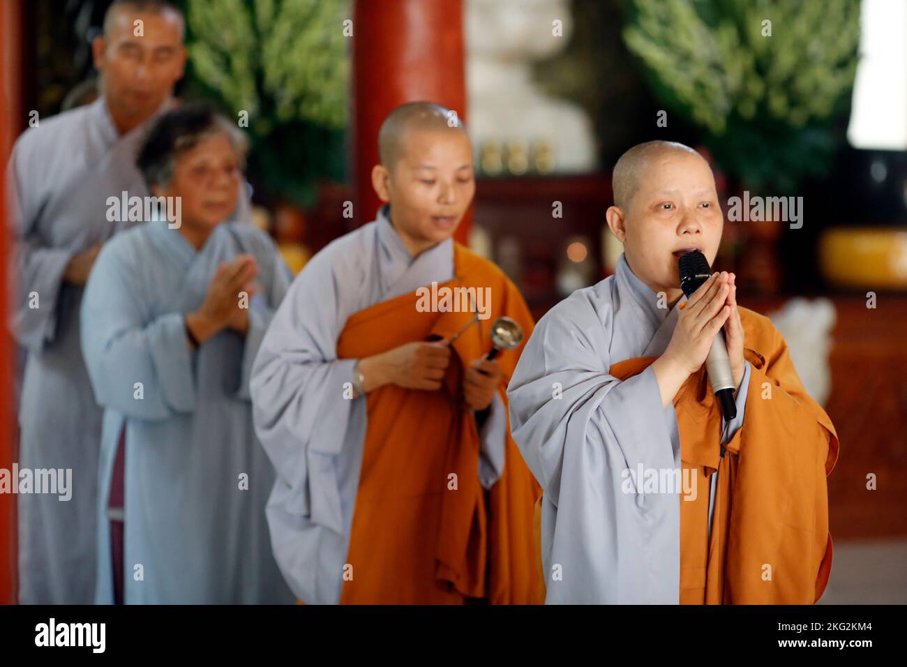 Thien Quang Co Tu buddhist temple. Nun at buddhist ceremony playing ...