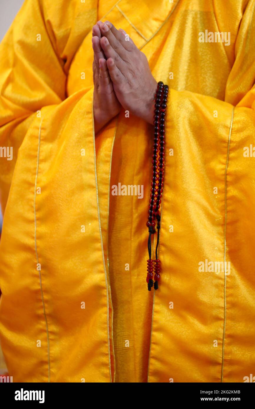Phuoc Long buddhist temple. Buddhist ceremony. Monk praying. Close up ...