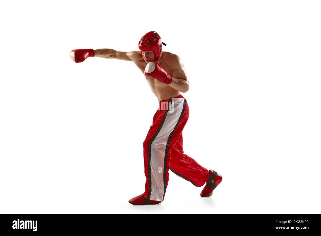 Punch. Young muscled athlete, professional kickboxer in protective ...