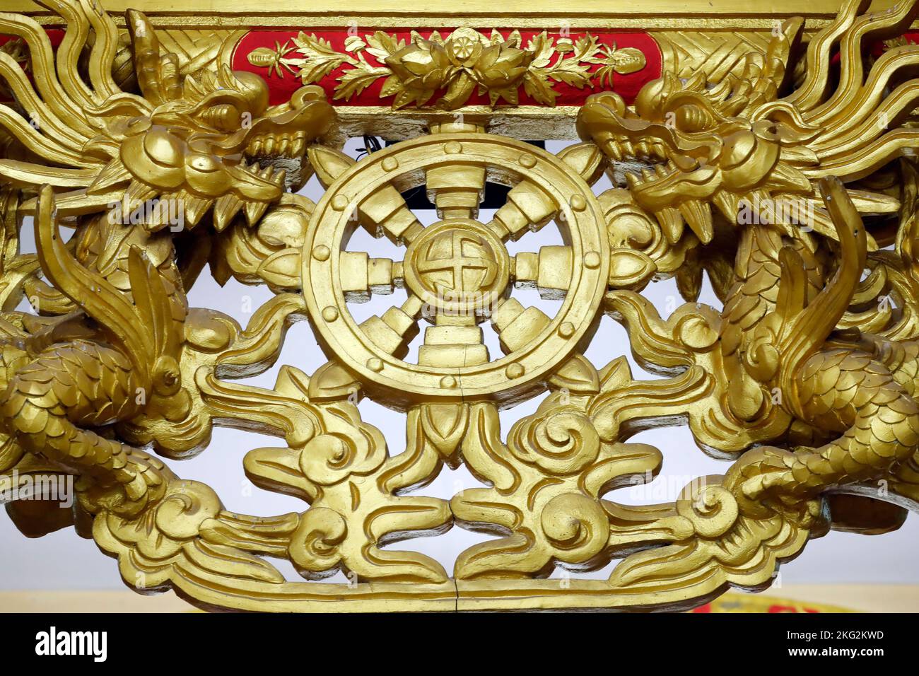 Long Duc buddhist temple. Two dragons and Dharma Wheel. Dharmachakra ...