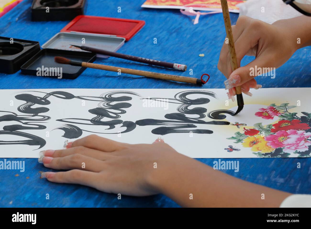 Phuoc Long buddhist temple. Calligraphy with black ink and brush. Tan ...