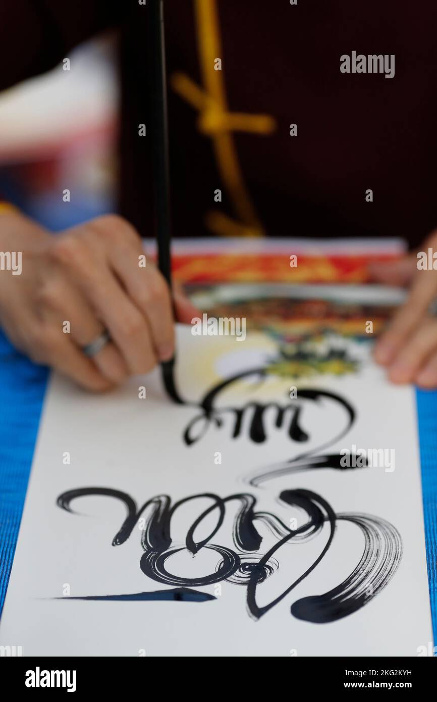 Phuoc Long buddhist temple. Calligraphy with black ink and brush. Tan ...