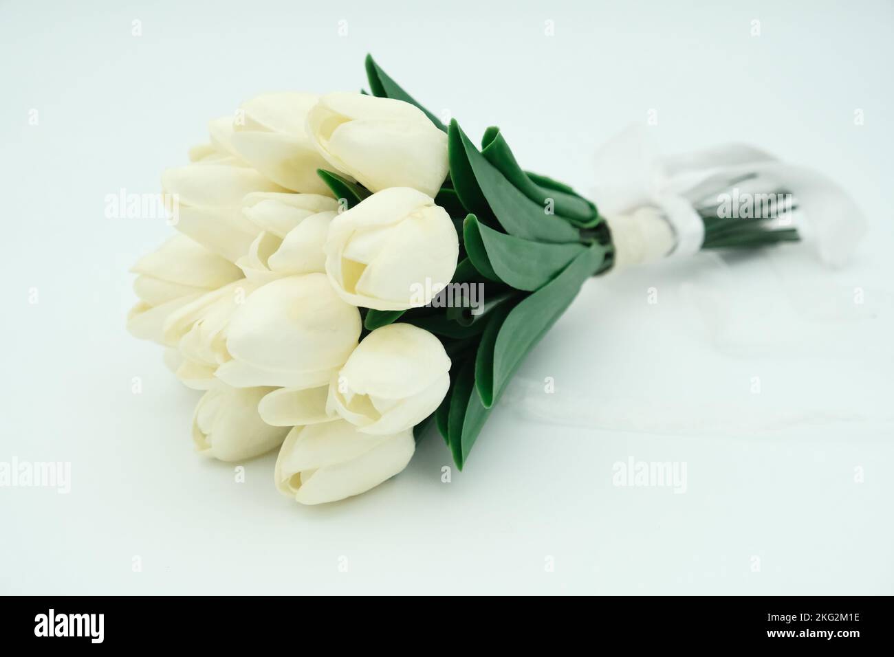 a bouquet of white tulips on white background - artificial flower Stock ...