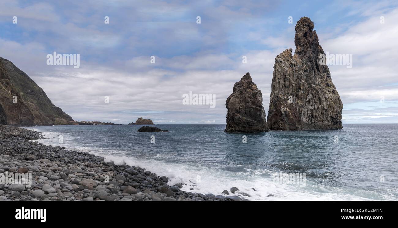 landscape of ocean shore at Madeira island with steep basalt cliffs ...