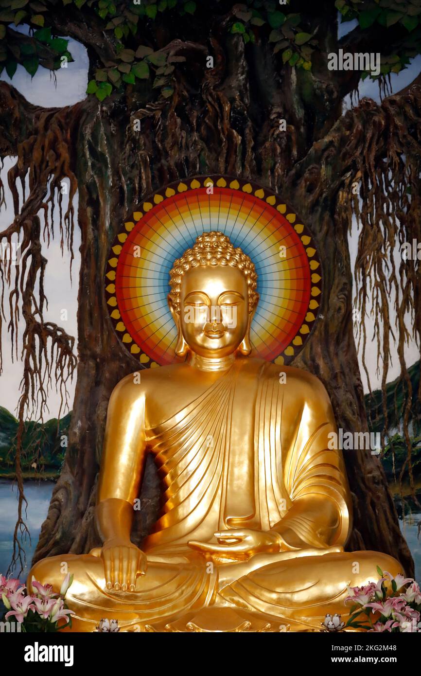 Buddhist temple. Main altar with golden Buddha statue. Buddha sitting ...