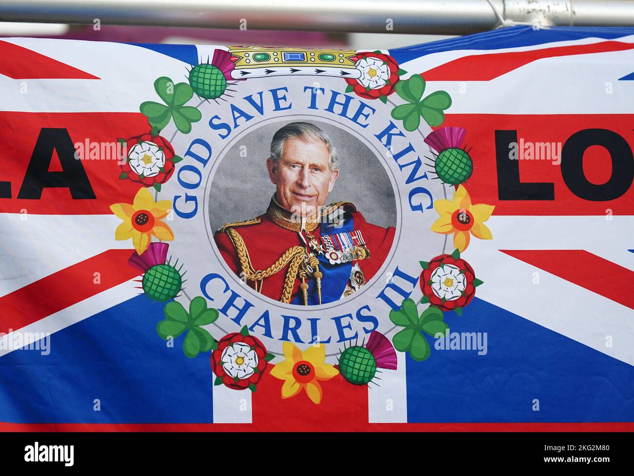 A Union flag with God Save The King and a picture of King Charles III ...
