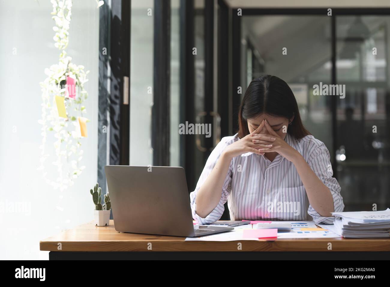Asian women are stressed while working on laptop, Tired asian ...
