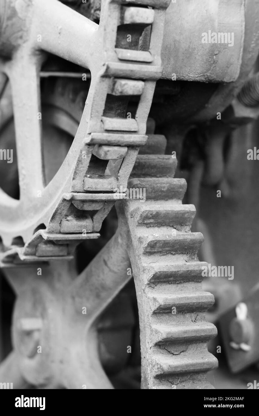 Vintage mechanical machine and engine with chains and gears in a black ...