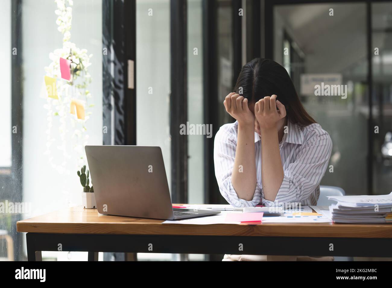 Asian women are stressed while working on laptop, Tired asian ...
